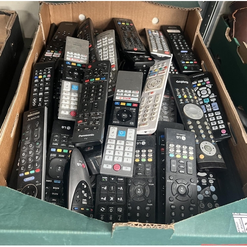 Box containing a large quantity of assorted remote controls