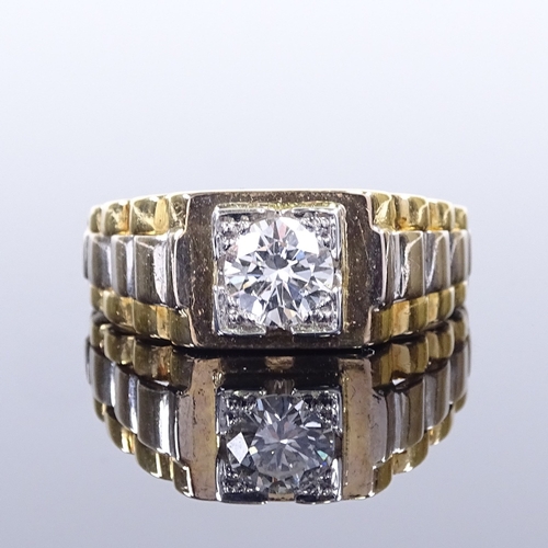 An 18ct gold 0.66ct solitaire diamond ring, Rolex style shoulders ...