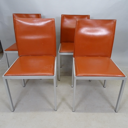 A set of 4 contemporary design saddle leather and steel dining chairs