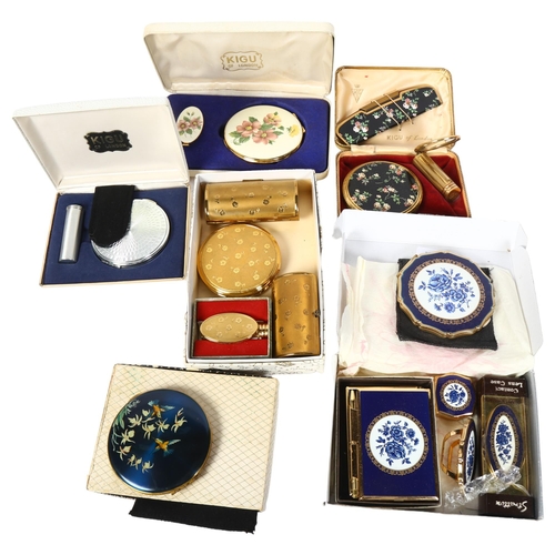A collection of 6 boxed Kigu compact sets