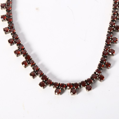 A sterling silver and garnet set fringe necklace, length 44cm
