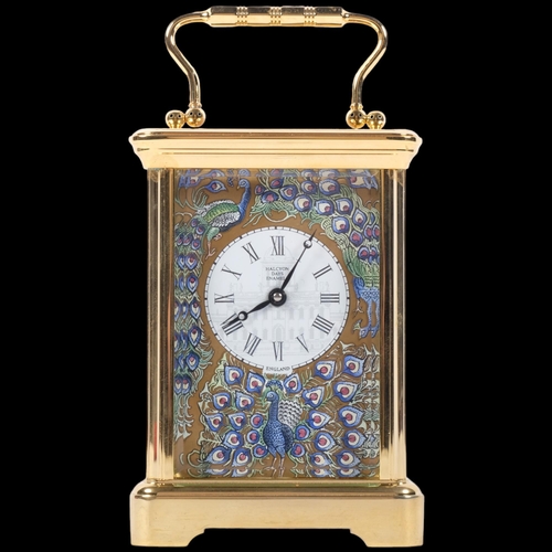 A Halcyon Days brass carriage clock, with white enamelled and coloured ...
