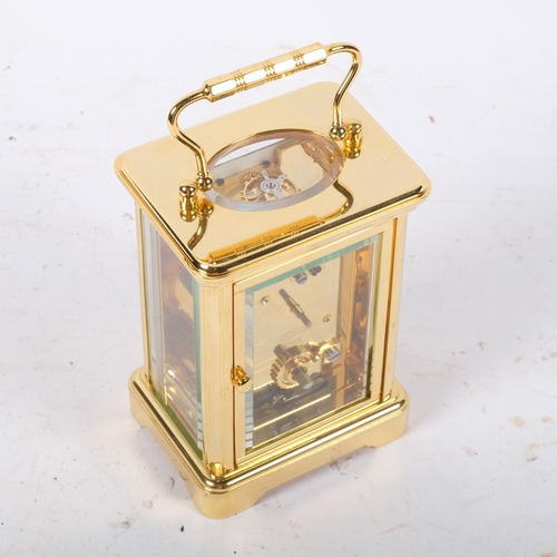 A Halcyon Days brass carriage clock, with white enamelled and coloured ...