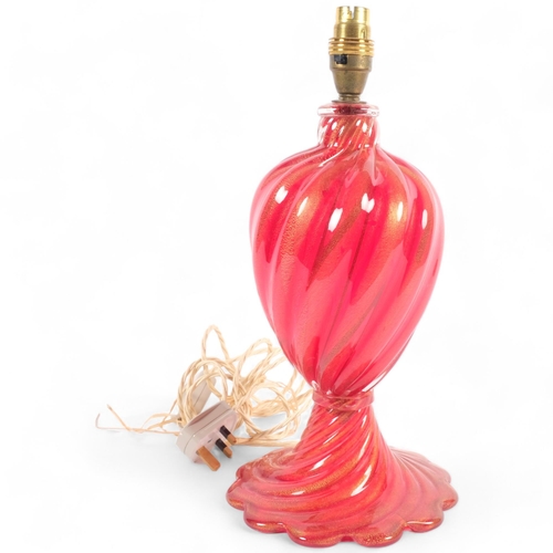 A Murano red glass table lamp of swirled design, height 36cm overall