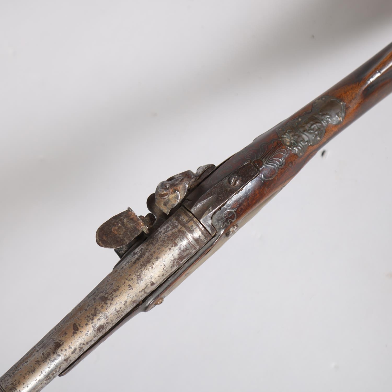 Antique flintlock rifle, assembled from various parts of other rifles