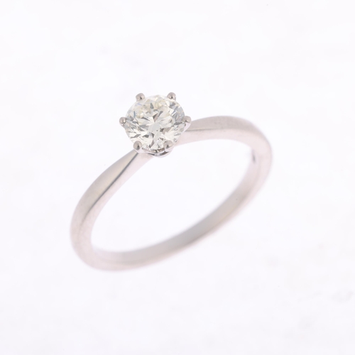 A platinum 0.7ct solitaire diamond ring, 6-claw set with modern round ...