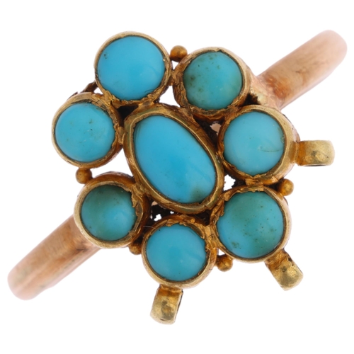 An Antique turquoise cluster ring, set with round and oval cabochon ...
