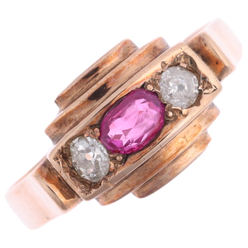 An early 20th century three stone ruby and diamond ring, set with oval ...