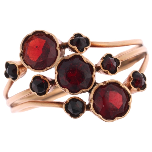 A French 9ct gold garnet flowerhead dress ring, setting height 13.6mm ...