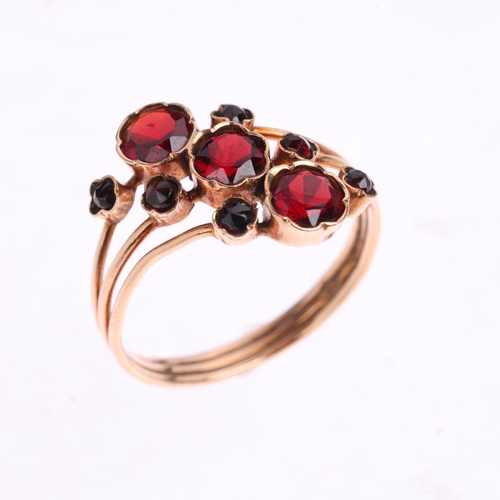 A French 9ct gold garnet flowerhead dress ring, setting height 13.6mm ...