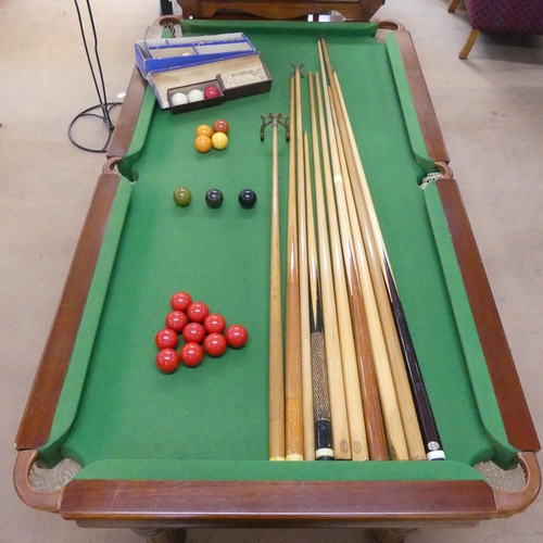 E.J. RILEY A dual purpose oak snooker / dining table, with complete set ...