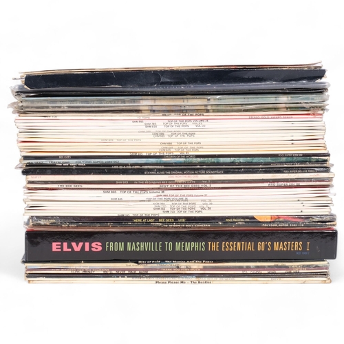 A quantity of vinyl records, both LPs and various 12" singles, various ...