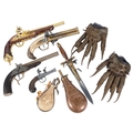 A group of reproduction weapons, including flintlock pistols, etc