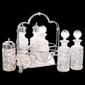 WALKER & HALL -a 20th century 6-bottle condiment set on fitted plated stand