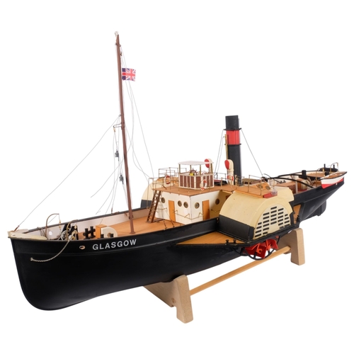A remote-controlled scratch-built scale model of the paddle steamer ...