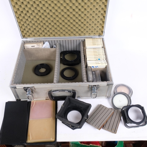 A small selection of camera filters, filter cases, etc
