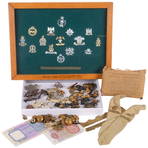 A framed collection of collar badges of the Royal Armoured Corps, a ...