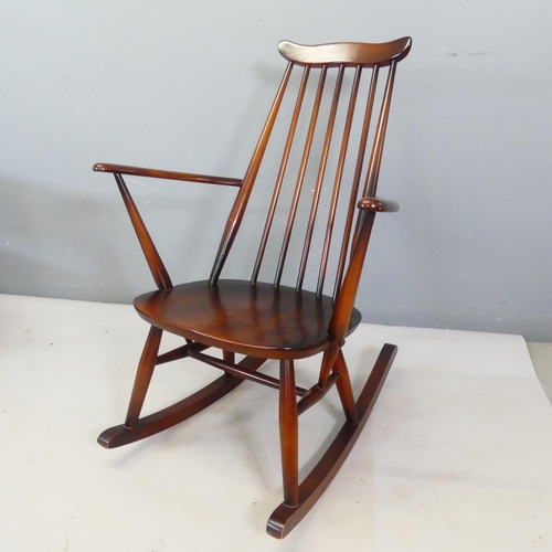 ERCOL - A mid-century stick back rocking chair. | Barnebys
