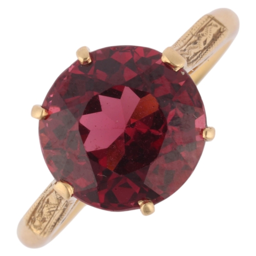A 9ct gold pyrope garnet single stone ring, claw set with 3ct round-cut ...