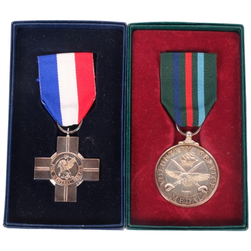 A hallmarked silver General Service Cross, and a hallmarked silver ...