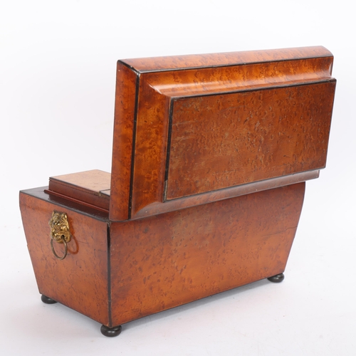 A 19th century amboyna sarcophagus-shaped tea caddy, with lion ring ...