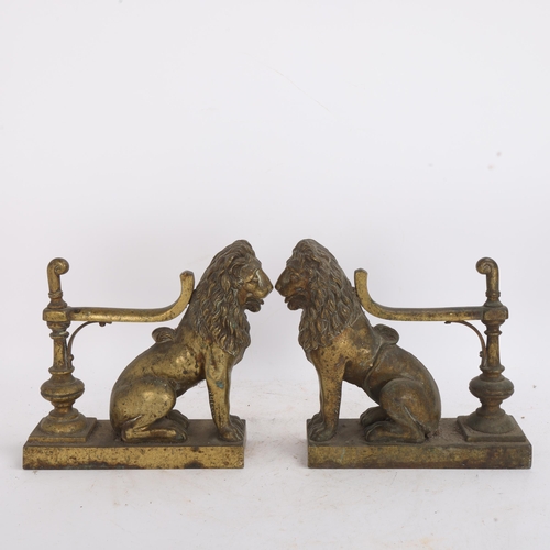 A heavy pair of 19th century brass lion design andirons, height 21cm ...