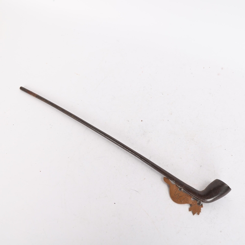 An 18th century steel Church Warden's pipe, with copper mount, length 39cm