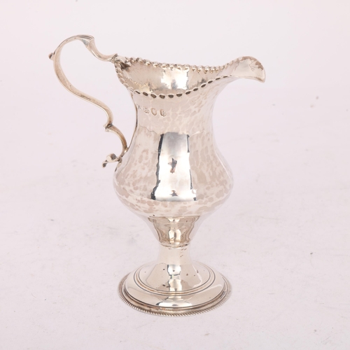 A George III silver cream jug, Hester Bateman, London 1782, baluster ...