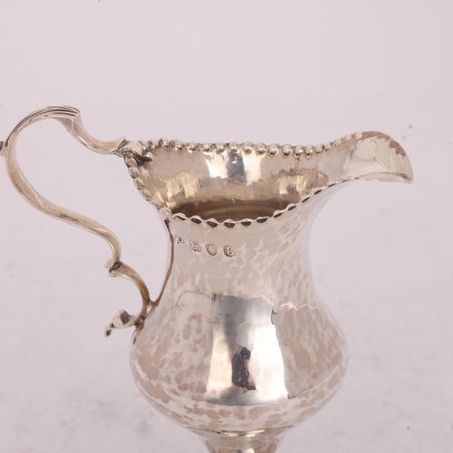 A George III silver cream jug, Hester Bateman, London 1782, baluster ...