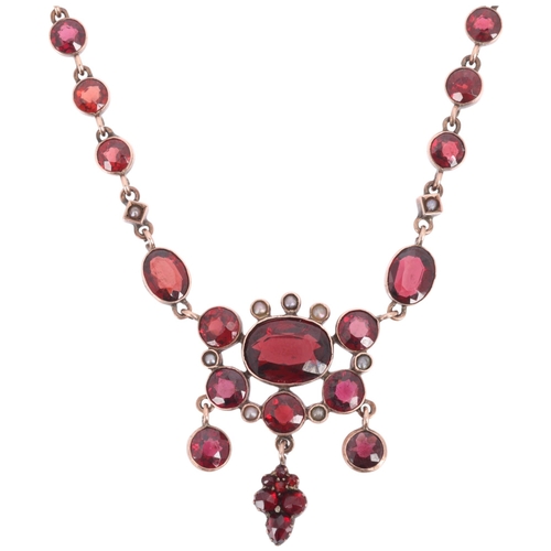 An Antique Victorian Bohemian garnet and pearl pendant necklace, rub ...