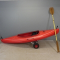 A Perception Kiwi Kayak with paddle and trolley, lenght 282cm.