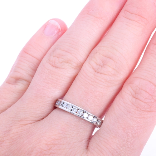 A palladium diamond half eternity ring, channel set with modern round ...