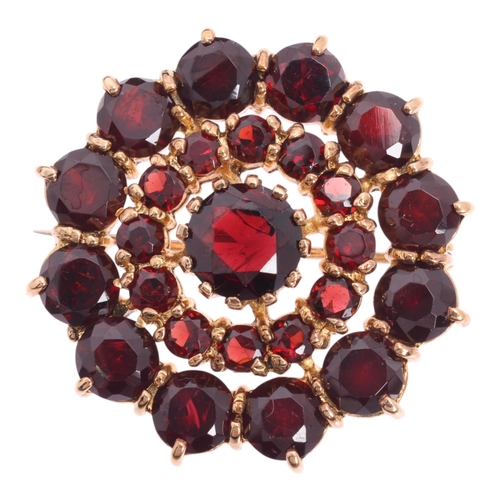 A 9ct gold garnet cluster brooch, maker B Ltd, London 1969, 27.8mm, 8.9g