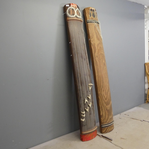 Two Japanese Koto instruments. Length 186cm.