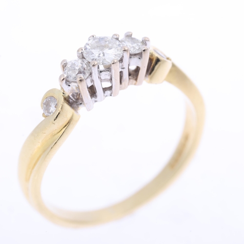 An 18ct gold three stone diamond ring, maker CJ, Birmingham 1994, set ...
