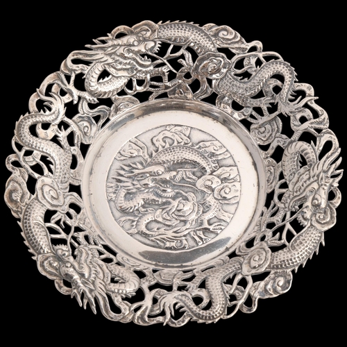 A Chinese export silver dragon dish, Luenwo, with relief embossed and ...
