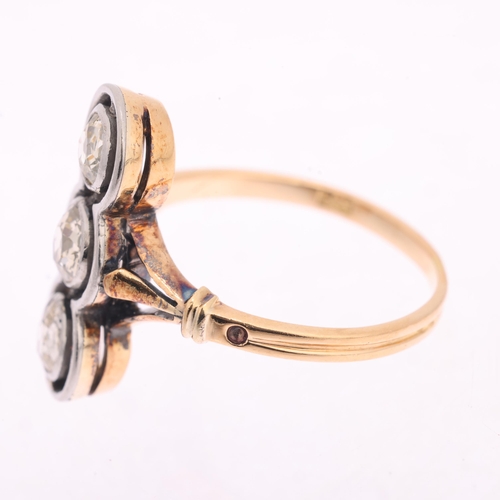 An Art Deco 18ct gold three stone diamond ring, vertically millegrain ...
