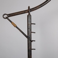 A vintage French blackened iron floor lamp with pivot arm and brass ...