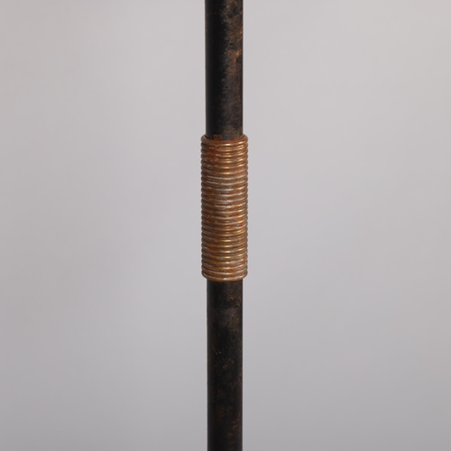 A vintage French blackened iron floor lamp with pivot arm and brass ...