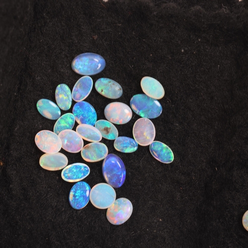 A quantity of unmounted opals, largest measures approx 6.19 x 4.14 x 1.81mm