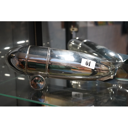 61 - Chrome Zeppelin Cocktail Shaker on wheeled base. 31cm in Length