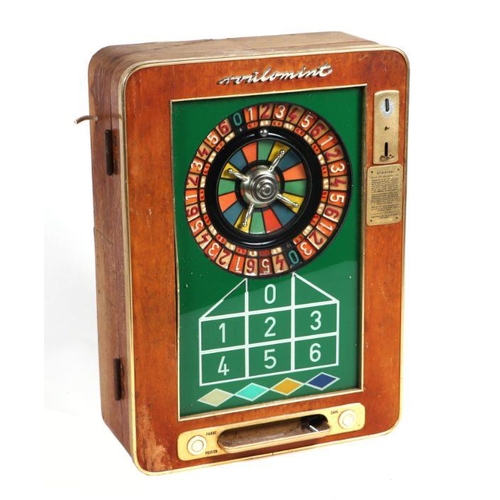 A mid century German Roulomint coin operated roulette machine, 51 by 71cms.