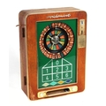 A mid century German Roulomint coin operated roulette machine, 51 by 71cms.
