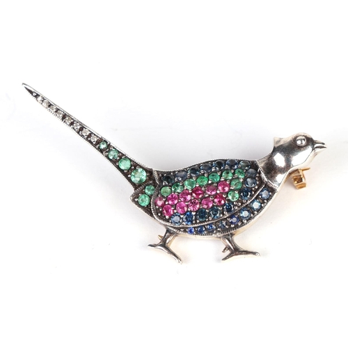 A yellow metal mounted pheasant brooch set with rubies, emeralds ...