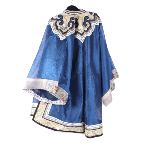 A Chinese silk embroidered robe with embroidered collars and cuffs on a ...