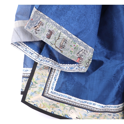 A Chinese silk embroidered robe with embroidered collars and cuffs on a ...