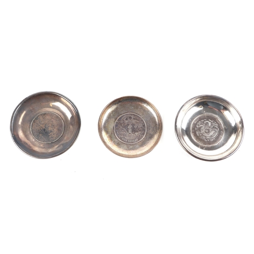 Three Chinese silver coin dishes, the largest 8cms diameter, 148g (3).
