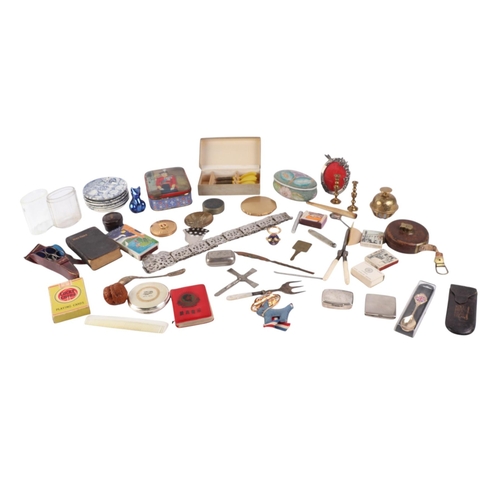 A quantity of small collectable items to include tape measure, crucifix ...