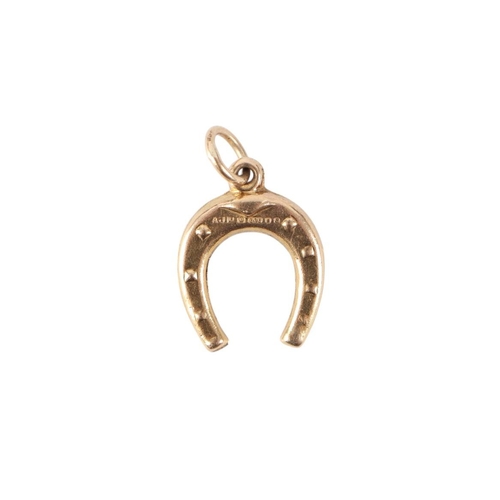 Two 9ct gold charms; together with a gold tooth and a yellow metal ...