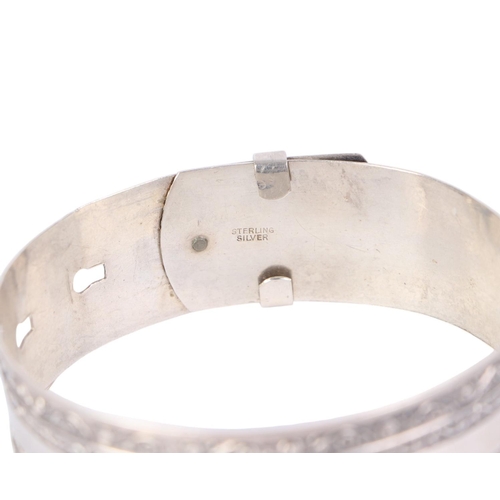A pair of sterling silver belt design bangles, 40g.